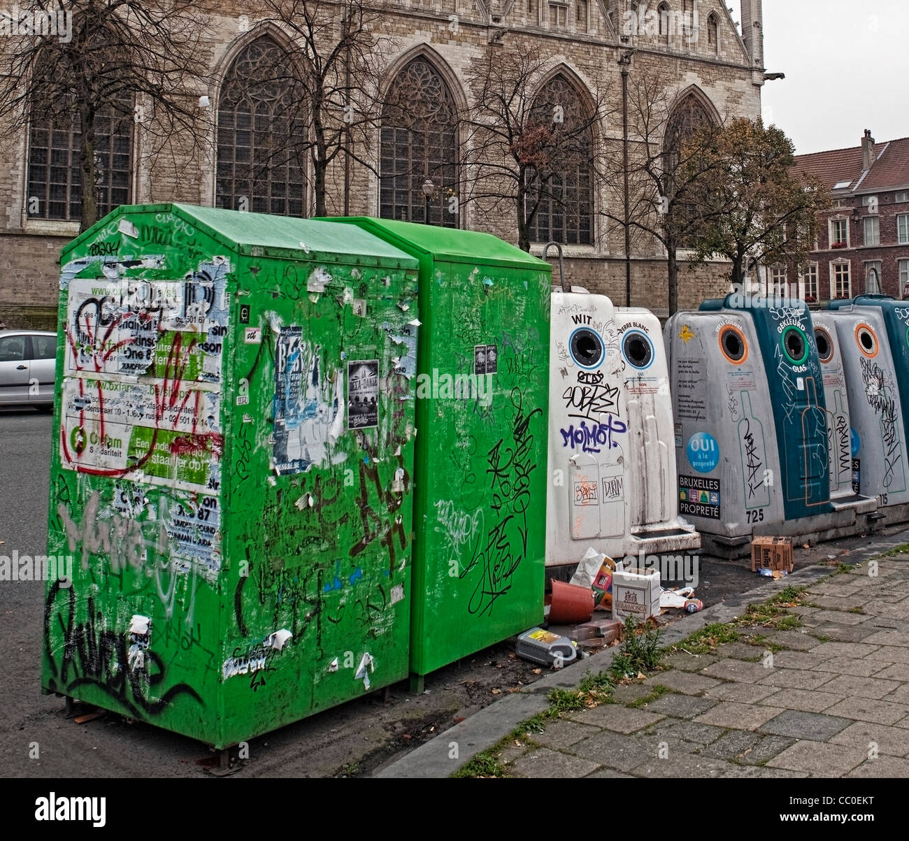 Overflowing rubbish containers close to a church Stock Photo - Alamy