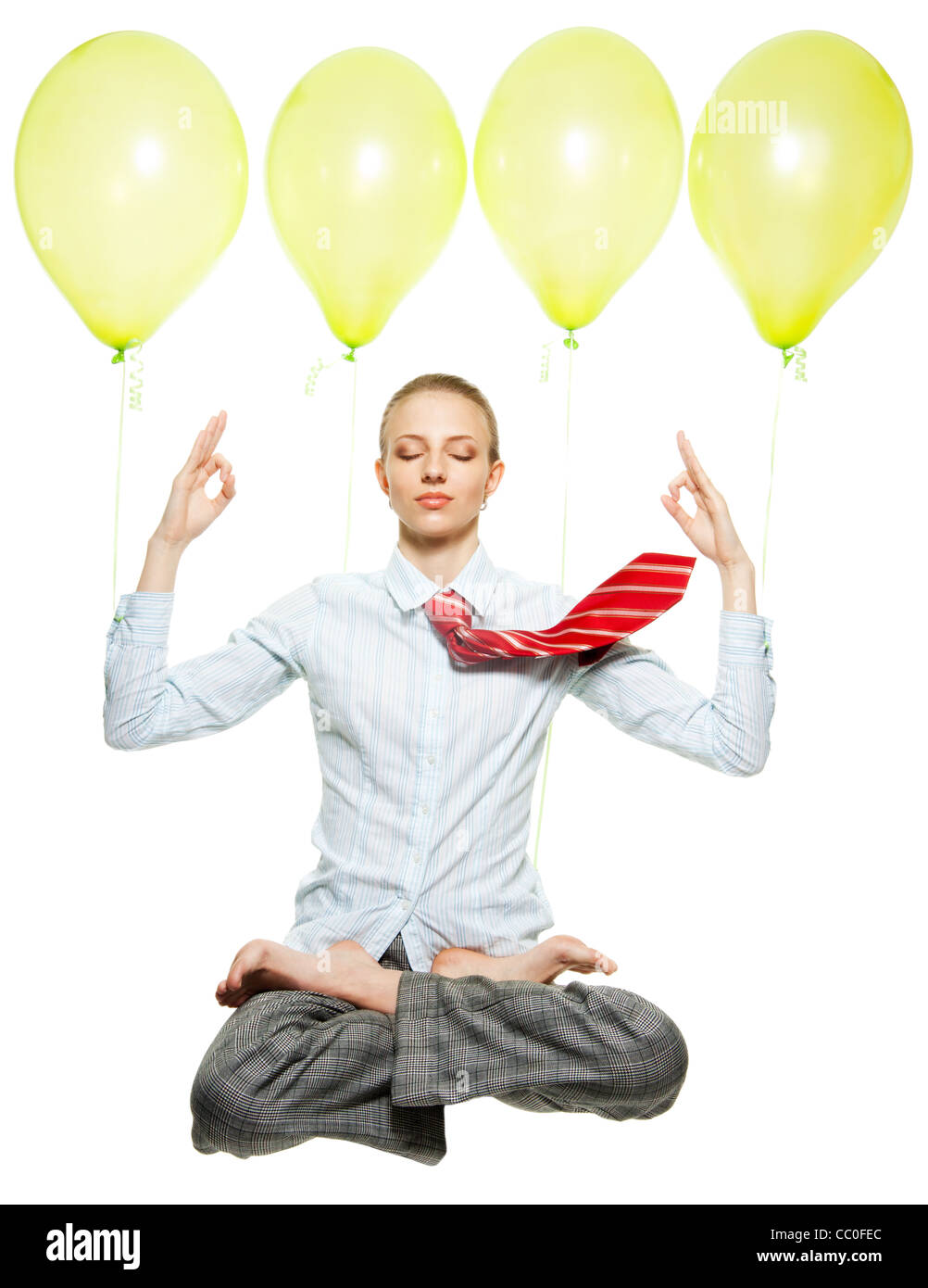 business woman sitting in lotus pose and flying on air balloons ...