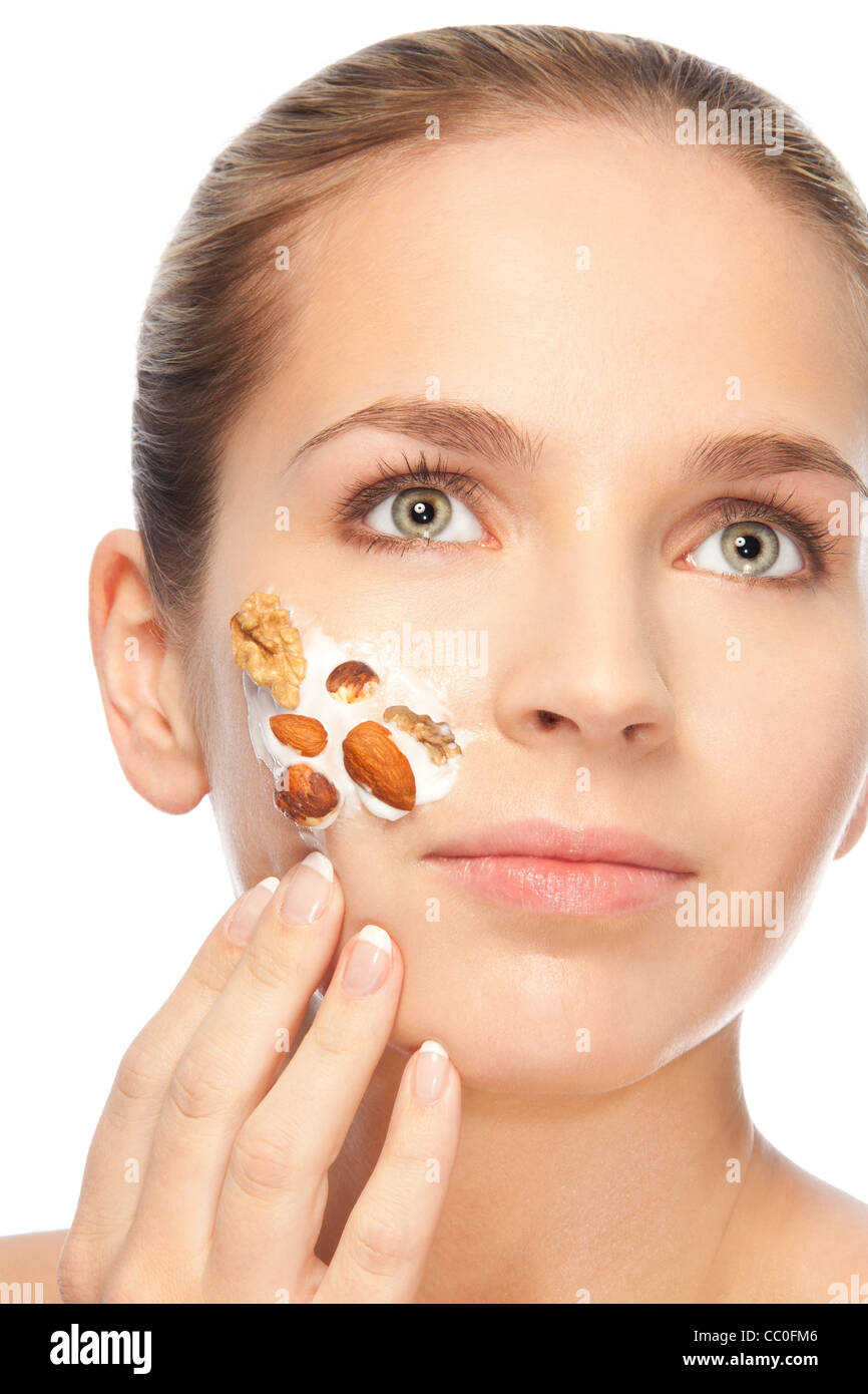 Young beautiful woman applying natural cosmetics depicting concept with ...