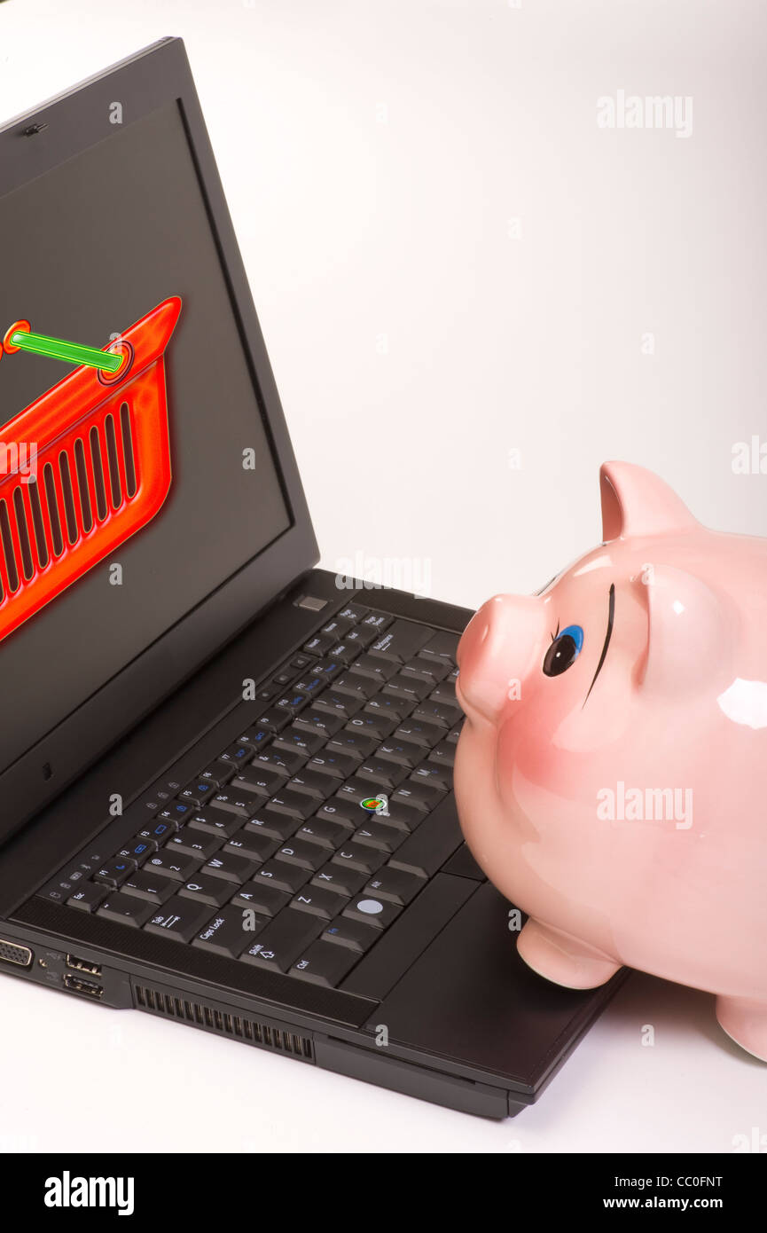 Pink Piggy Works On Computer Stock Photo - Alamy