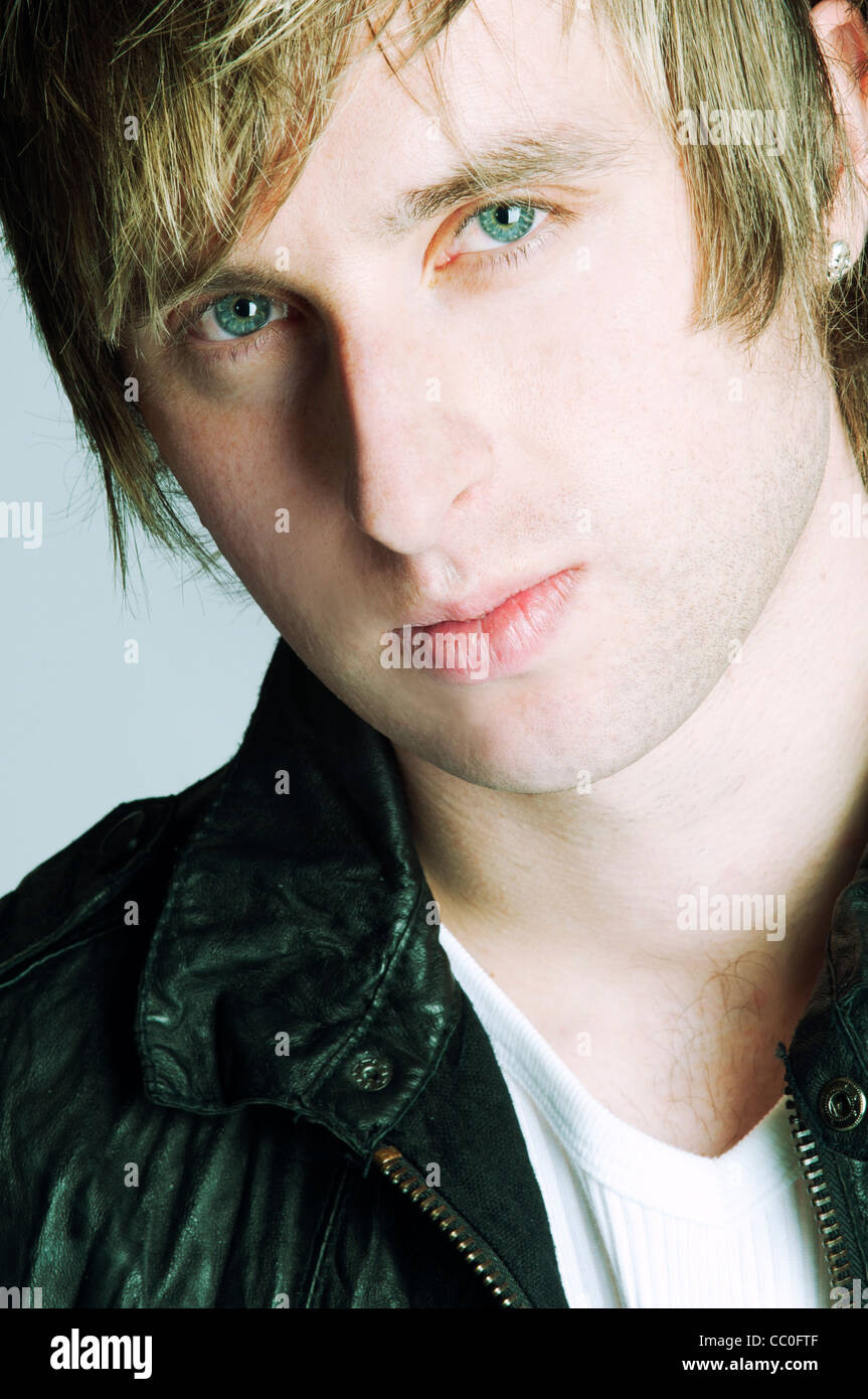 Handsome young man looking at the camera Stock Photo - Alamy