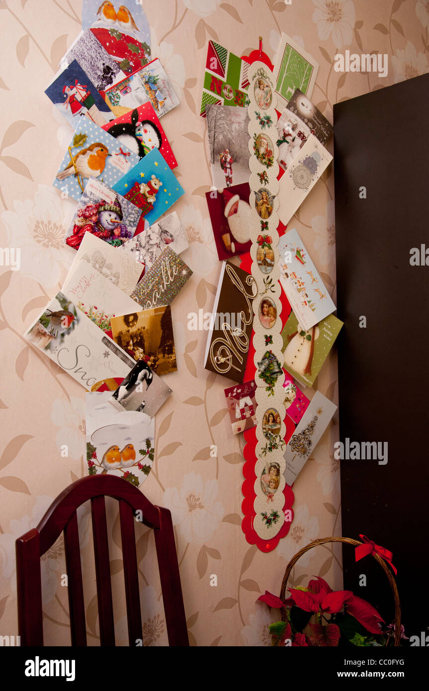 Christmas cards displayed as decorations in a living room Stock Photo ...