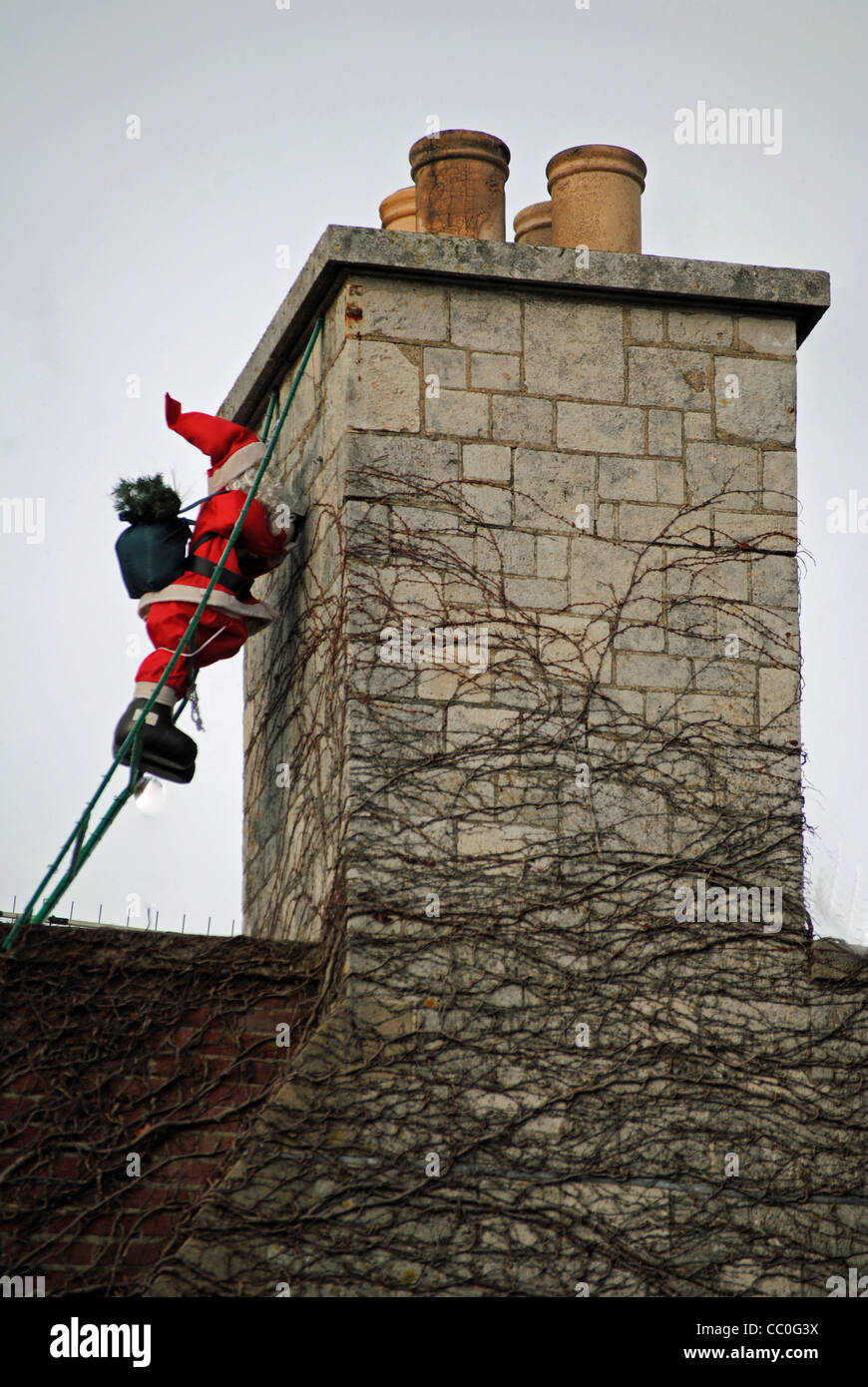 Santa claus climbing chimney hi-res stock photography and images - Alamy