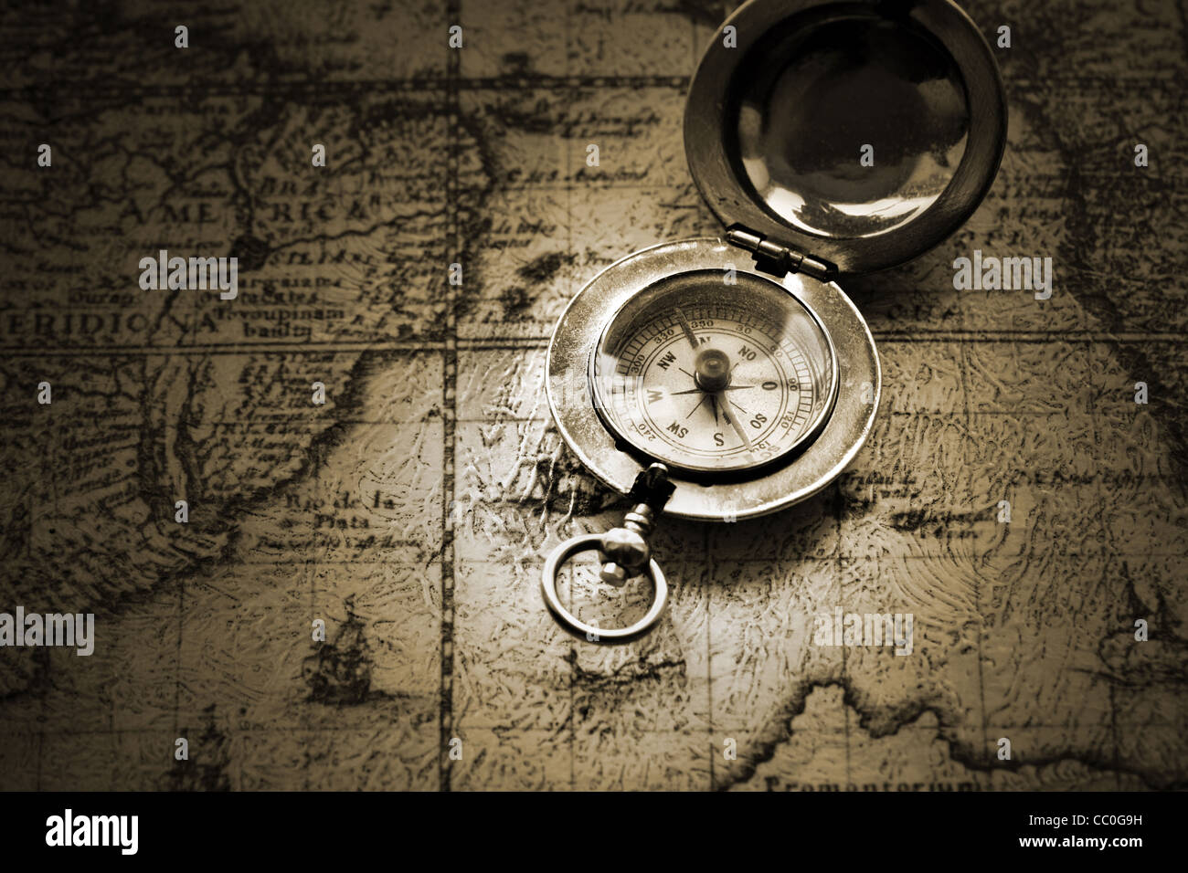old compass on vintage map Stock Photo - Alamy