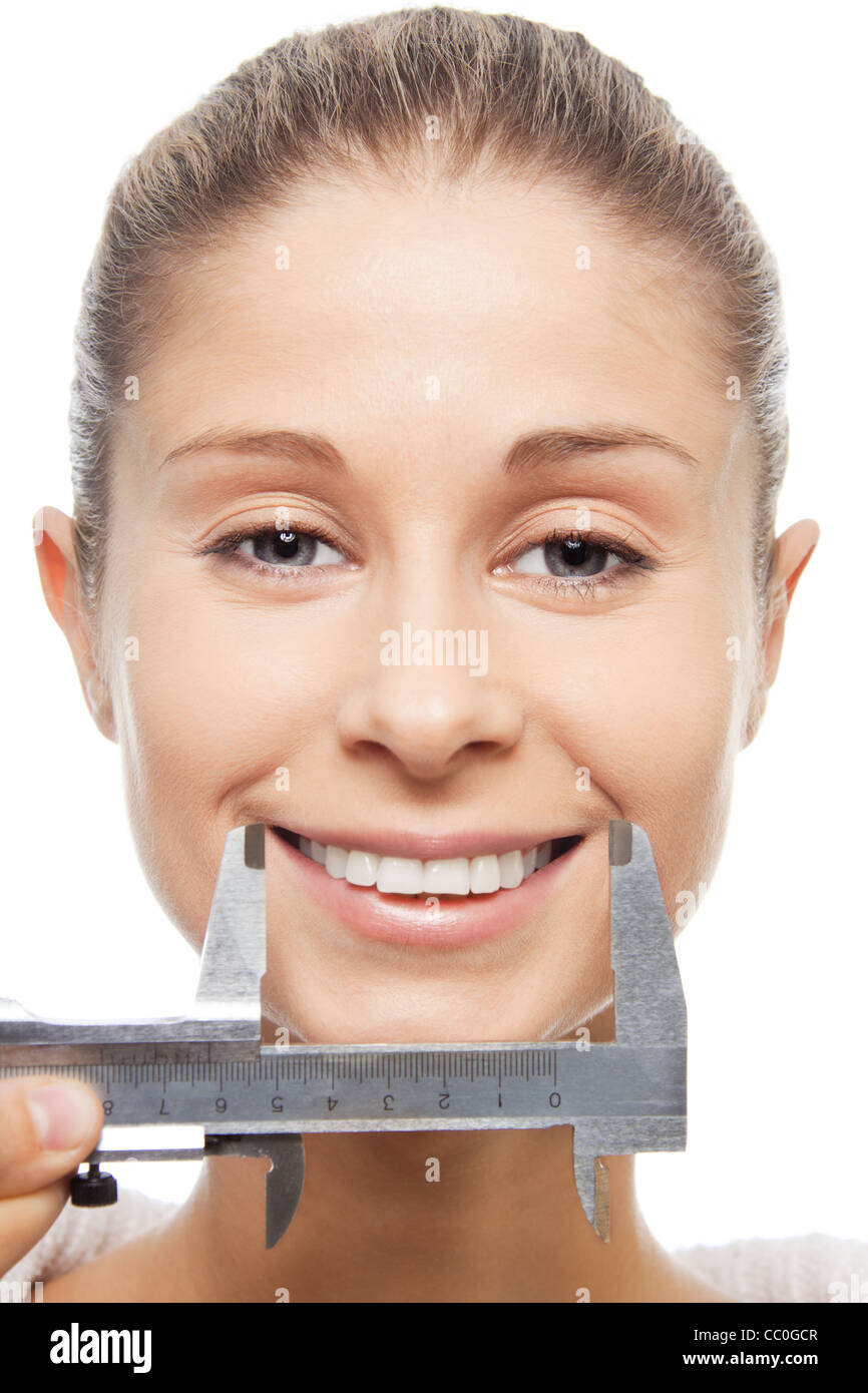 Measuring smile size with trammel - close-up portrait, isolated on ...