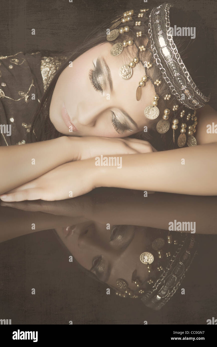 Beautiful young Arabian woman leaning down Stock Photo - Alamy