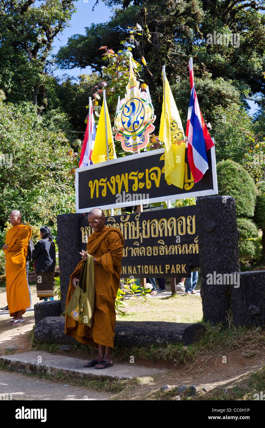 Wooden Doi Inthanon National Park sign with 2 Buddhist monks standing ...