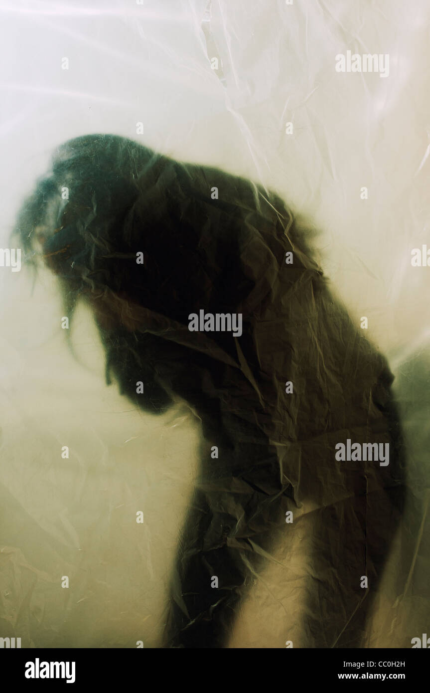 Mysterious female figure head in hands crying Stock Photo - Alamy