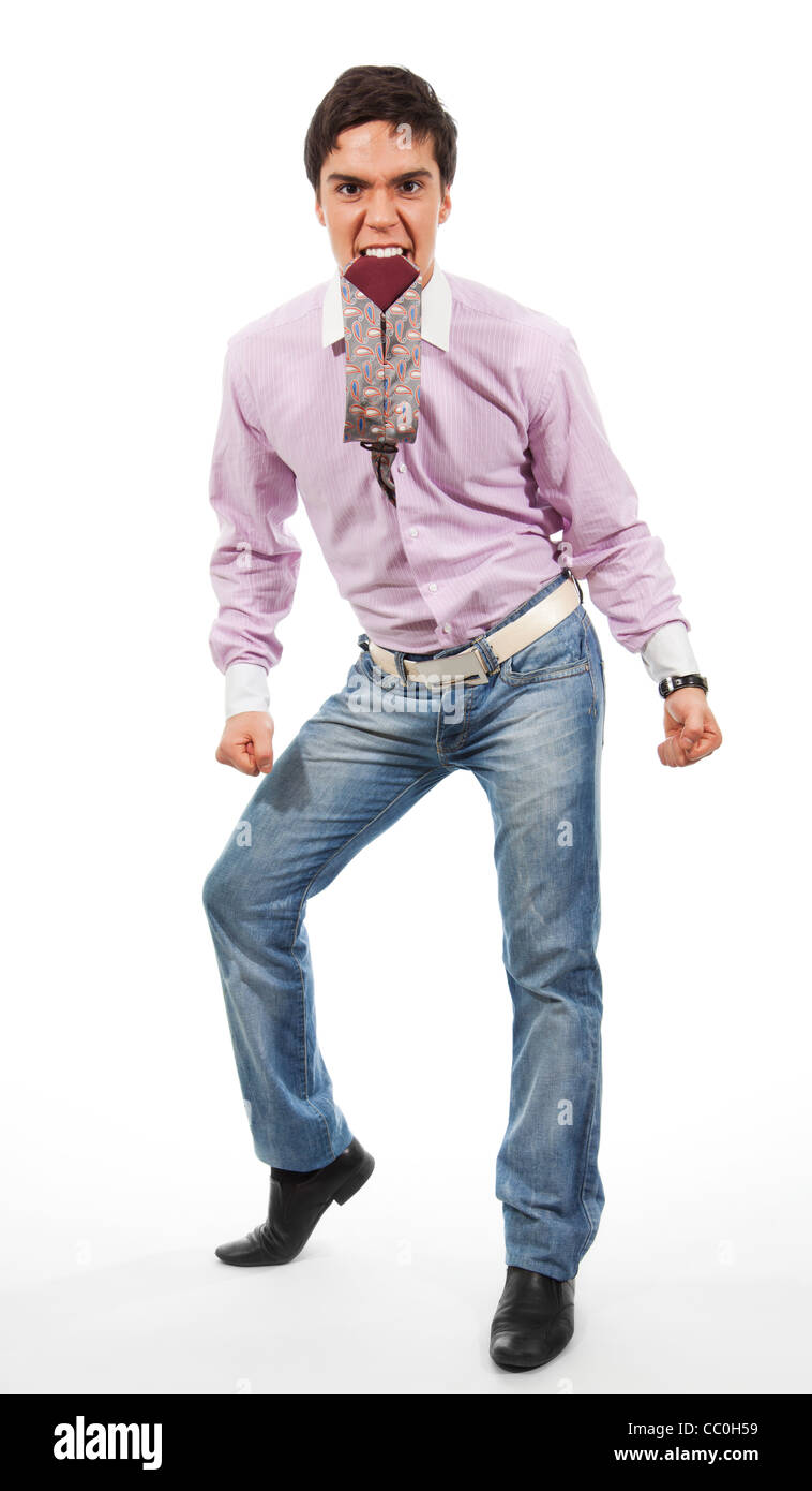 Angry and fierce looking man eating his tie, standing isolated on white ...