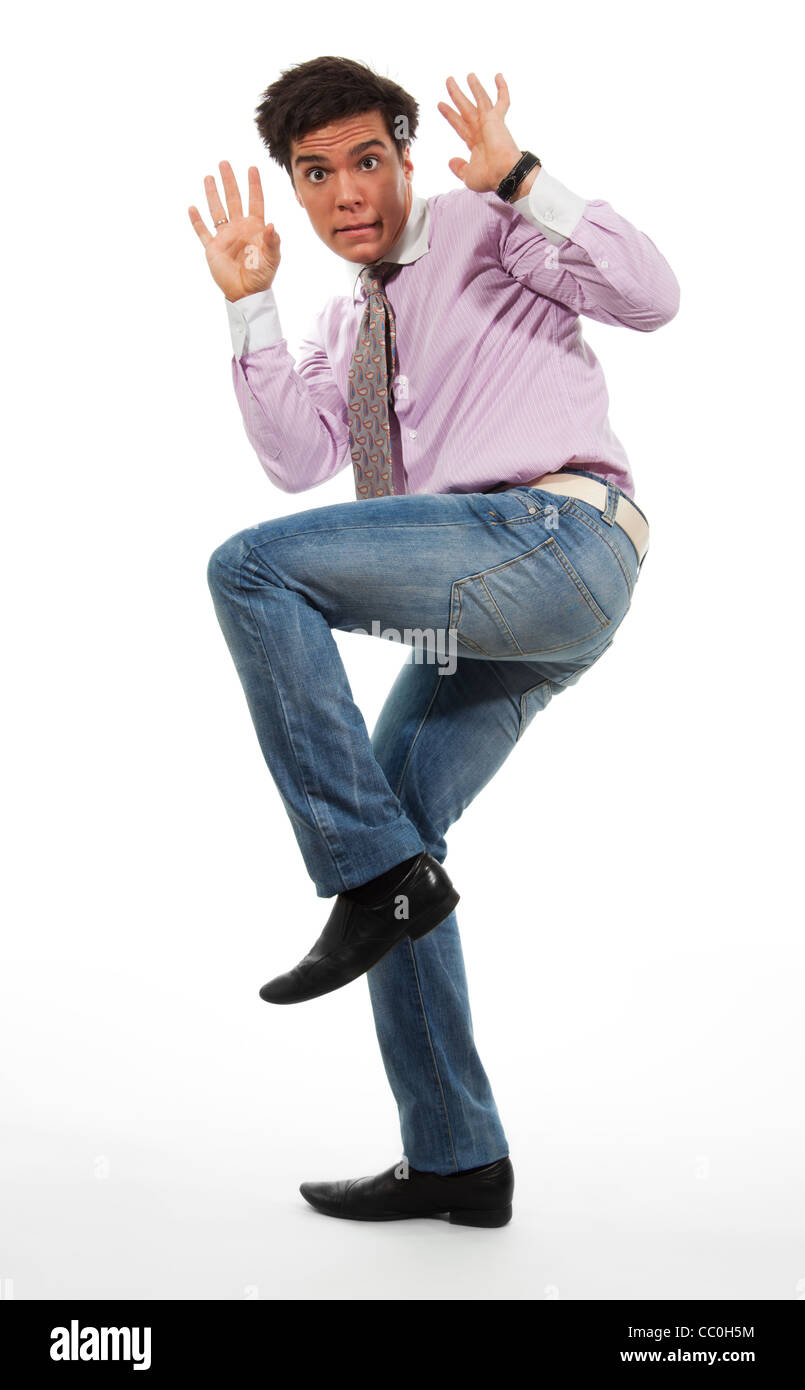 terrified man surrender wearing jeans, shirt and tie, isolated on white ...