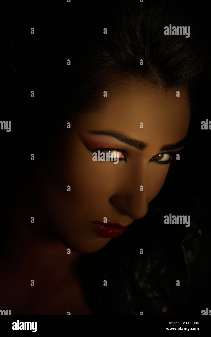 Mysterious woman staring Stock Photo - Alamy