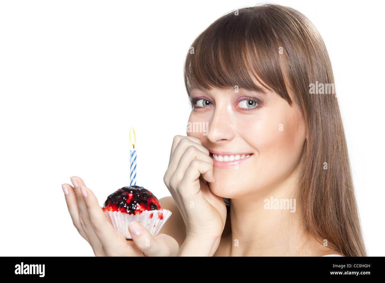 Happy embarrassed woman with a birthday cake Stock Photo - Alamy