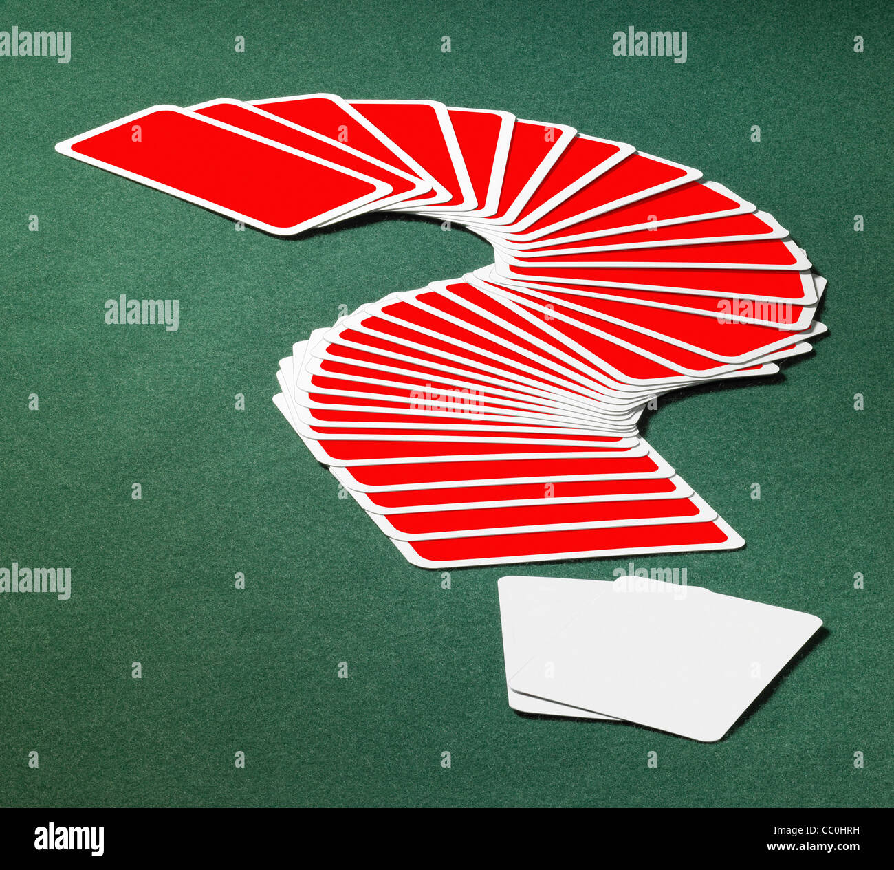 playing cards on green felt Stock Photo - Alamy