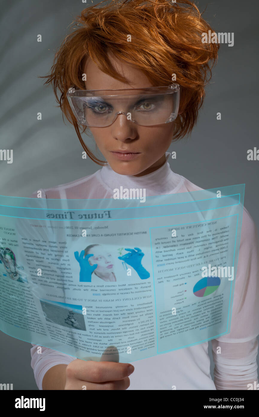 Future newspaper on transparent screen - beautiful woman holding ...