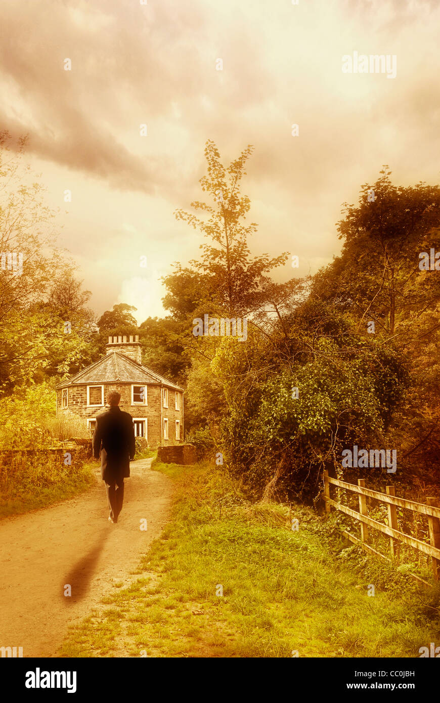 Man walking towards house in the countryside Stock Photo - Alamy
