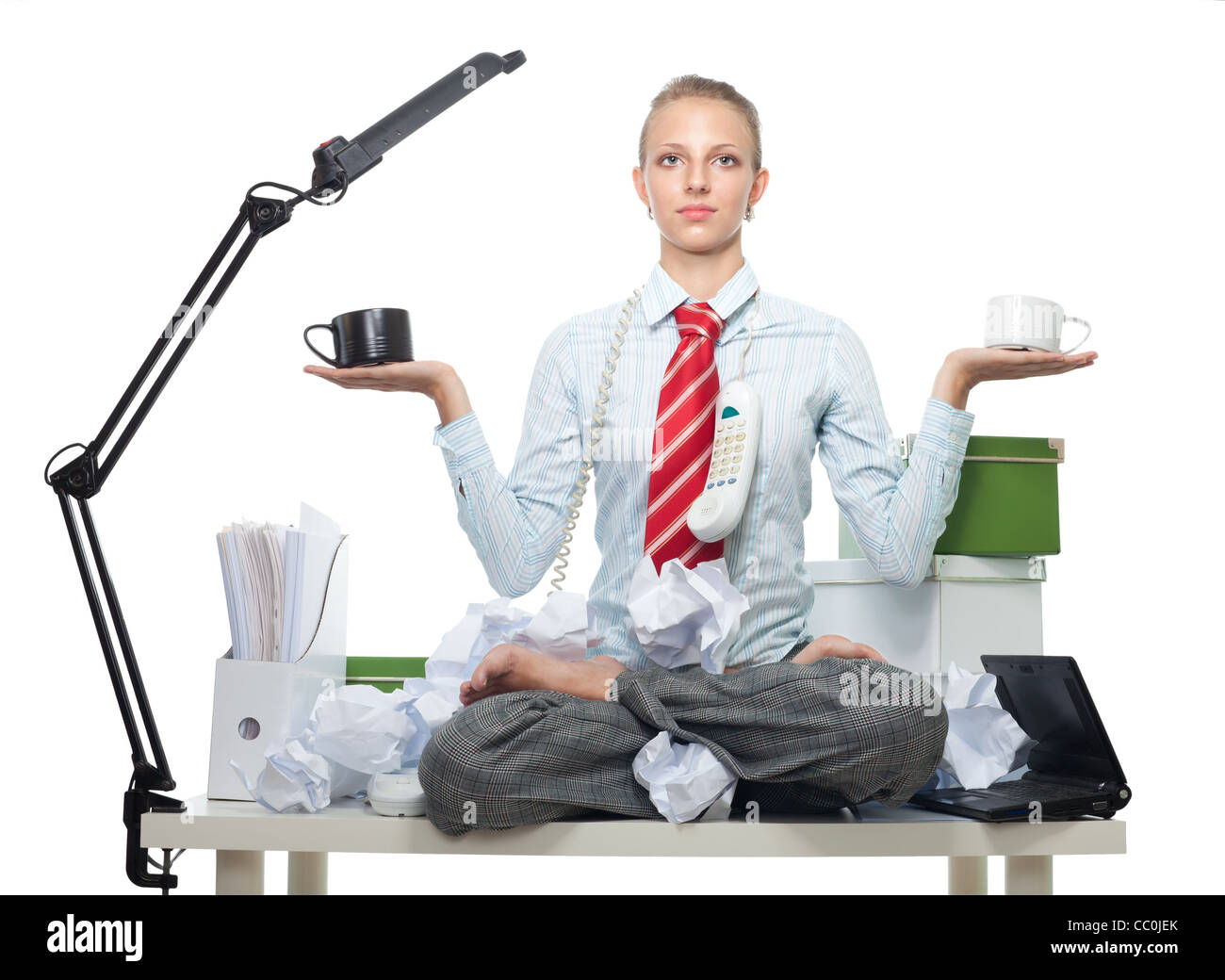 Keeping balance between god and evil in work - woman sitting on work ...