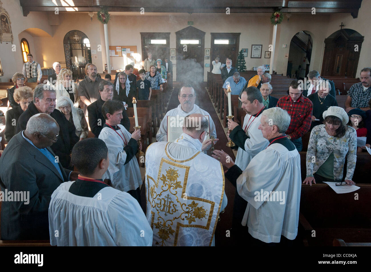 Father Christopher Stainbrook, an Anglican priest) performs a reading ...