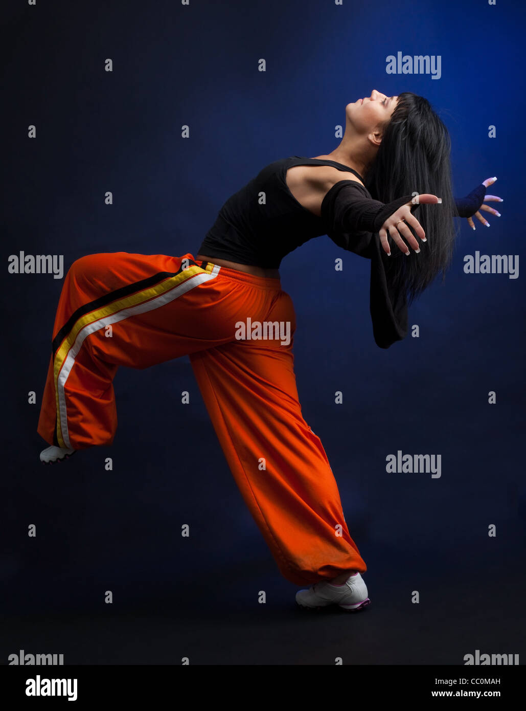 Modern style dancer woman performing side view Stock Photo - Alamy