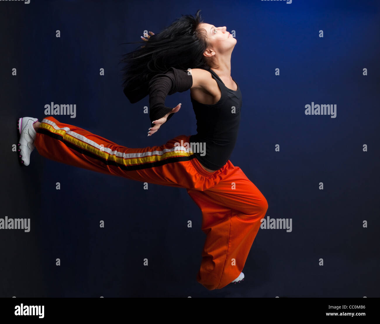Woman start running very fast forward on dark background Stock Photo ...