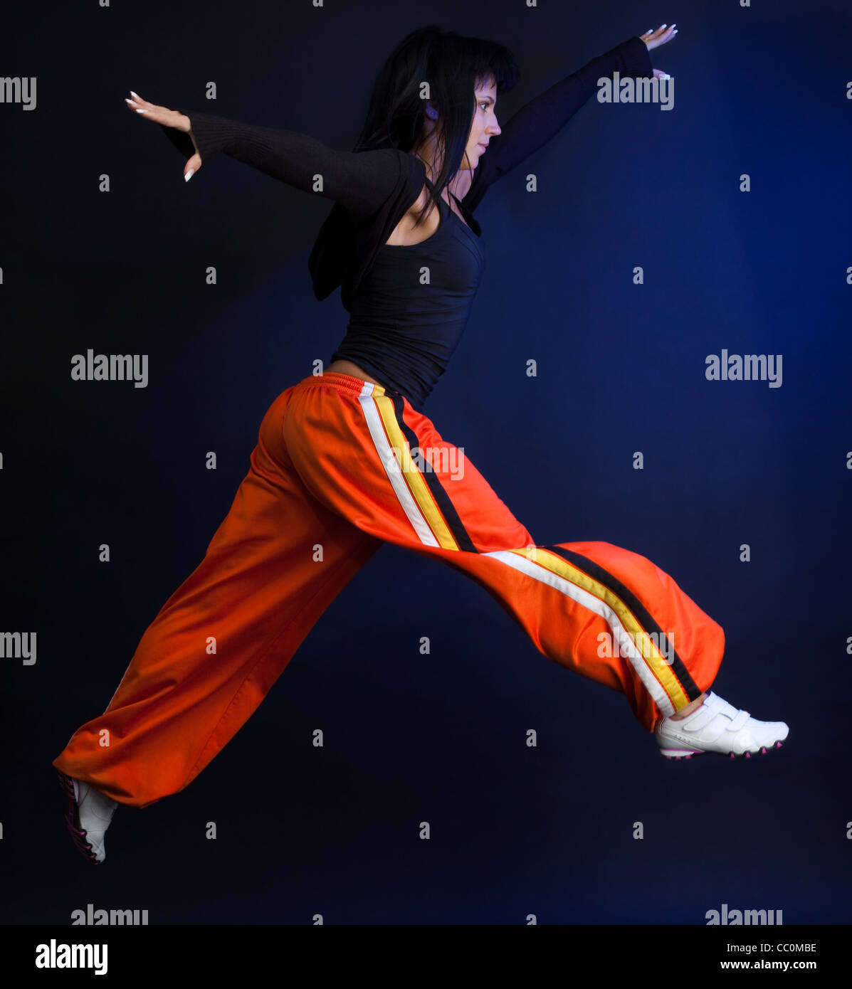 Woman dance in modern style performing jump Stock Photo - Alamy