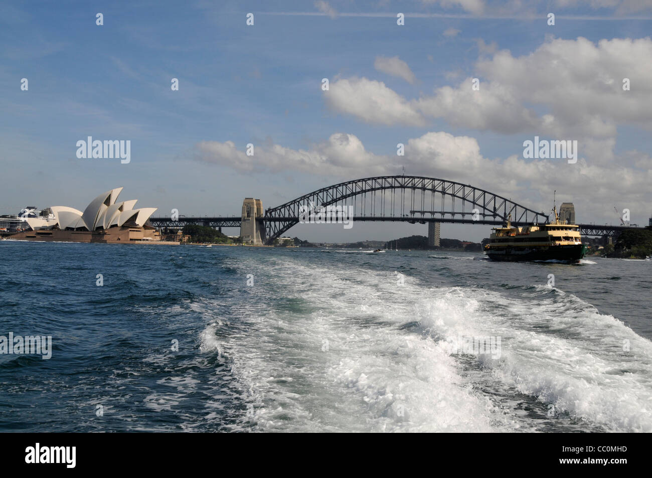 The Opera House and the Harbour Bridge from a boat in Sydney harbour ...