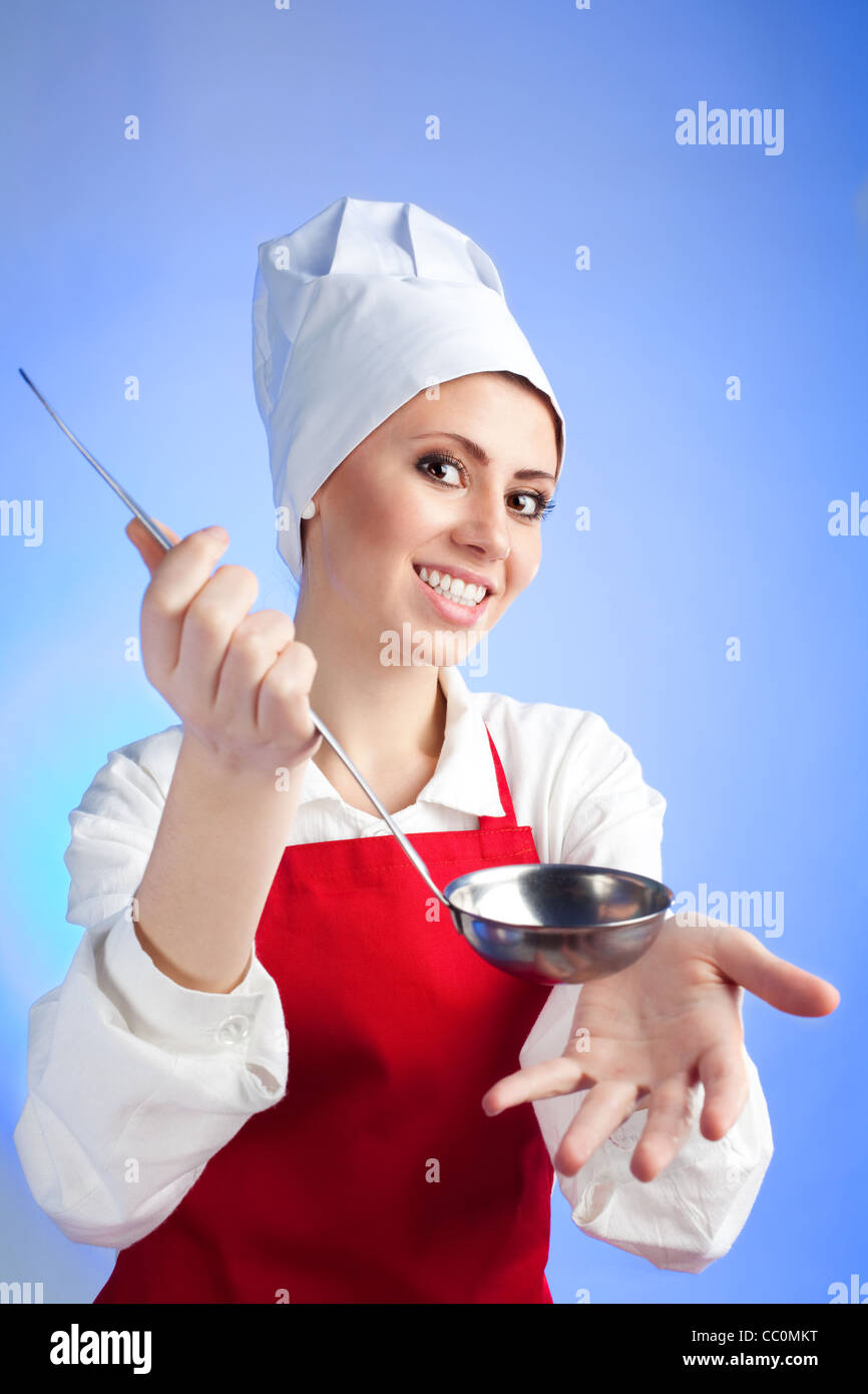 Chef offer soup holding ladle and smile Stock Photo - Alamy