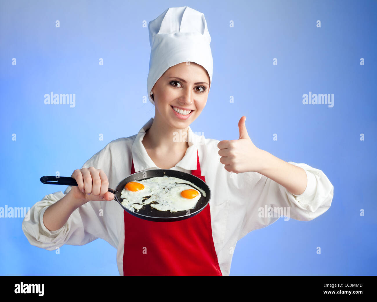 Chef stand with frying egg and pan with big smile and thumb up Stock ...