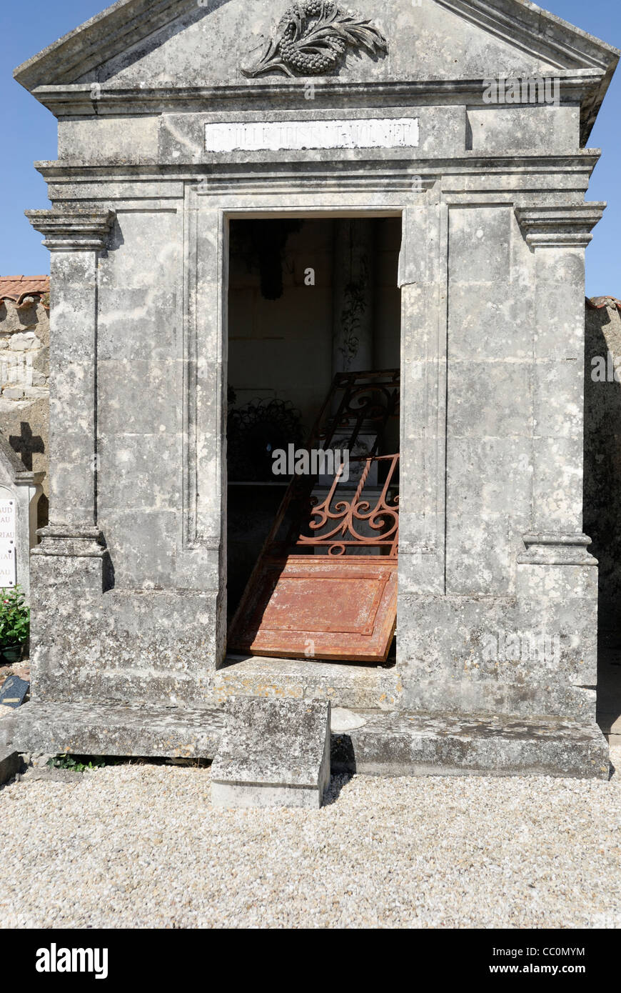 Crypt with a damaged metal door at a small French cemetery in St ...