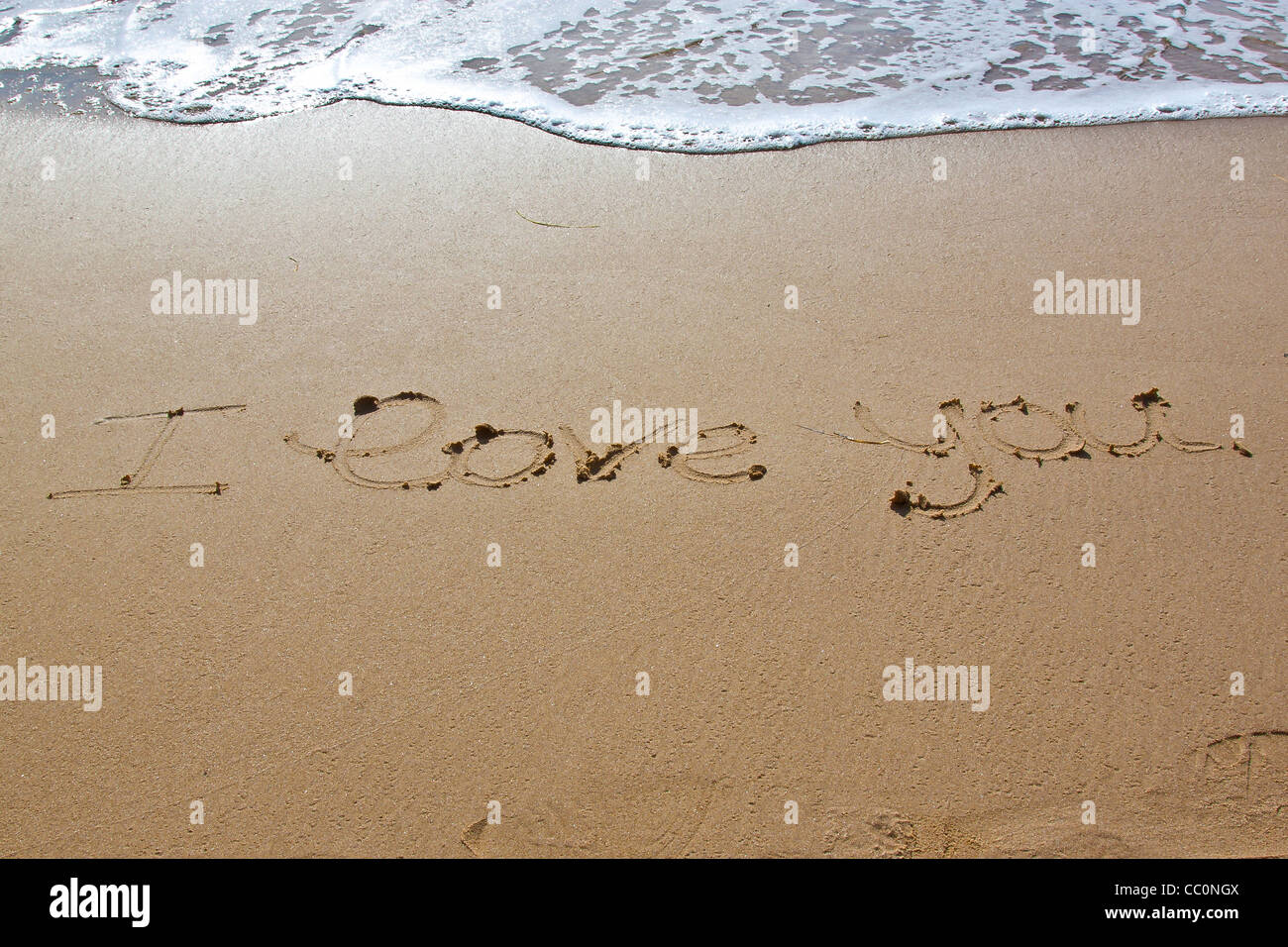 i love you written in sand Stock Photo - Alamy