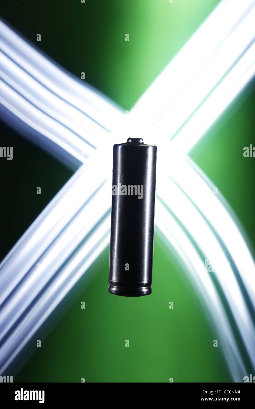 battery with blue lightning isolated on green background Stock Photo ...