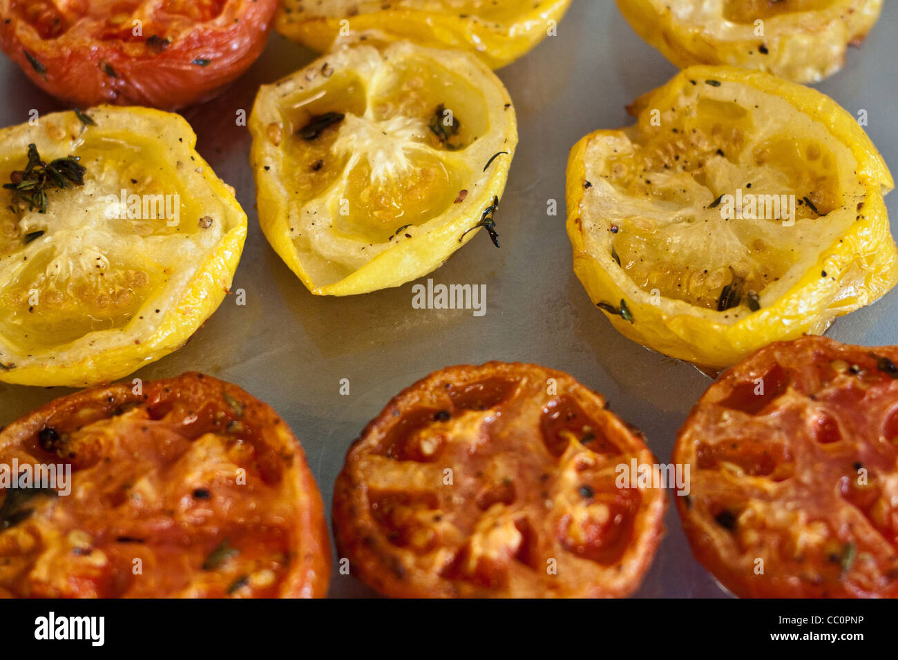Roasted organic red and yellow tomatoes Stock Photo - Alamy