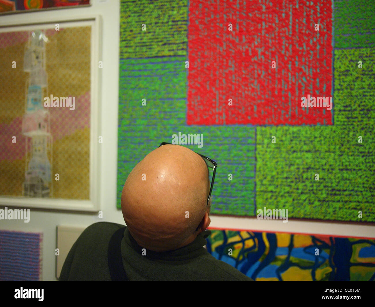 Guest at art opening, Sideshow Gallery, Brooklyn, New York Stock Photo ...