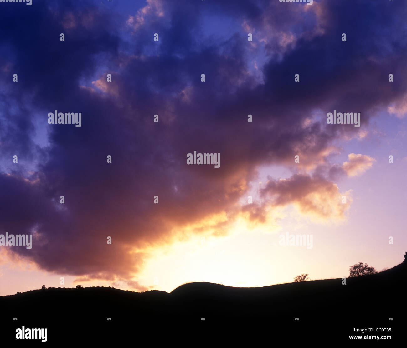 Clouds Over Hillside at Sunset or Morning Stock Photo - Alamy