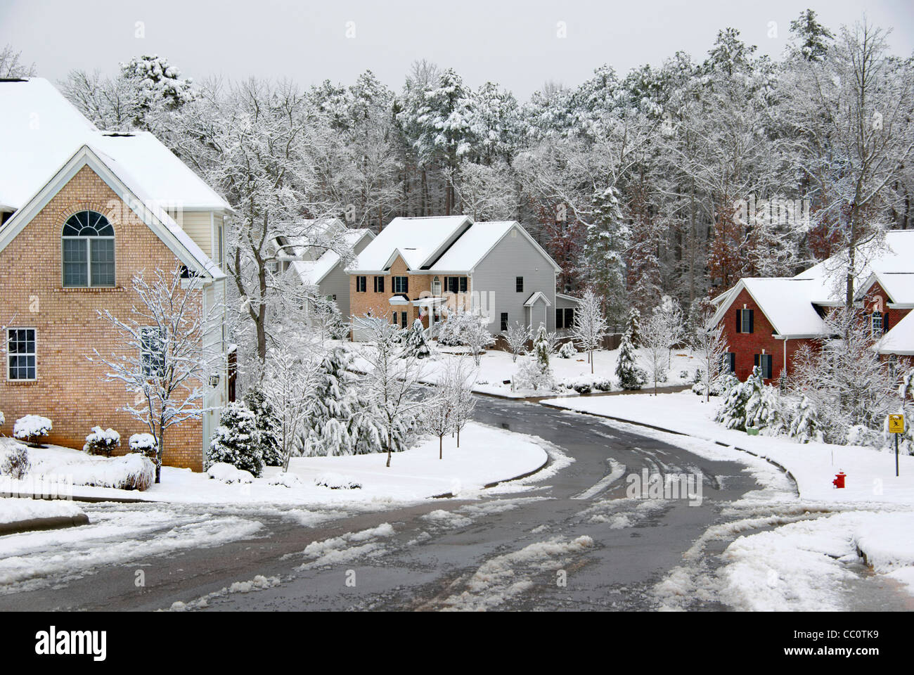 Residential subdivision neighborhood in snowy winter condition Stock ...