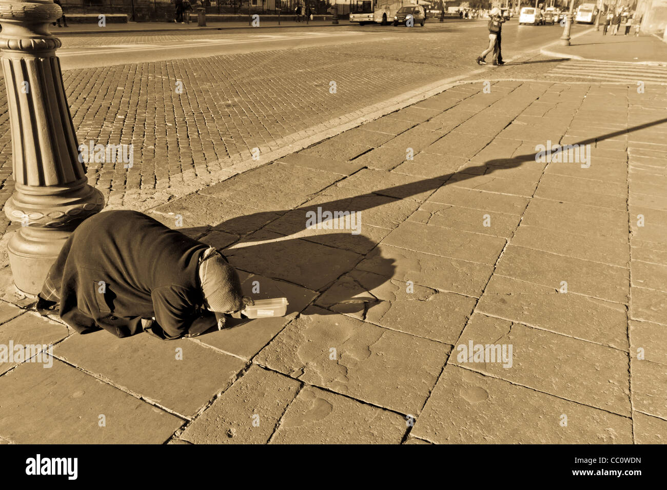 A woman panhandler begging for money on the streets of Rome Stock Photo ...
