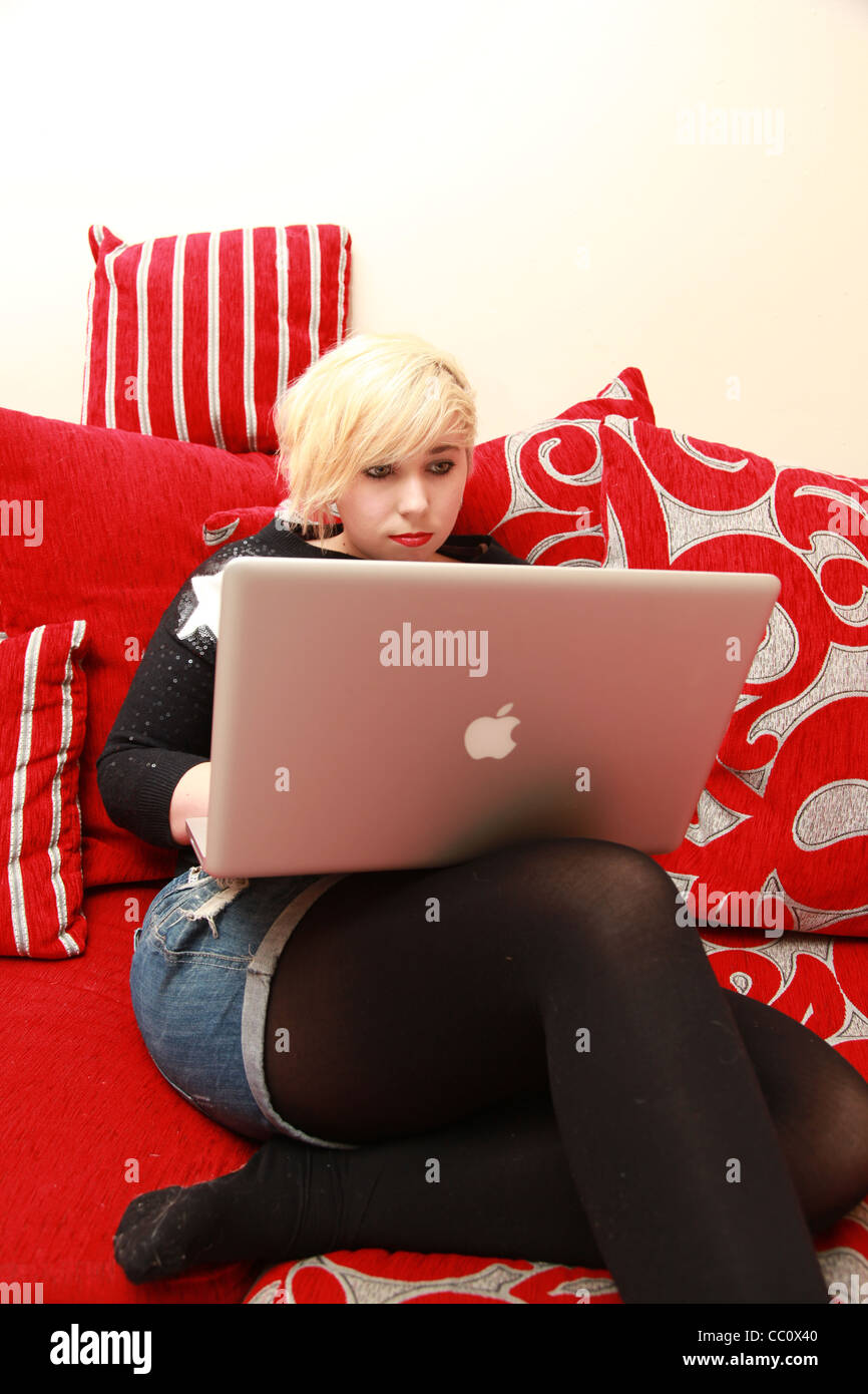 Student using an Apple laptop Stock Photo - Alamy