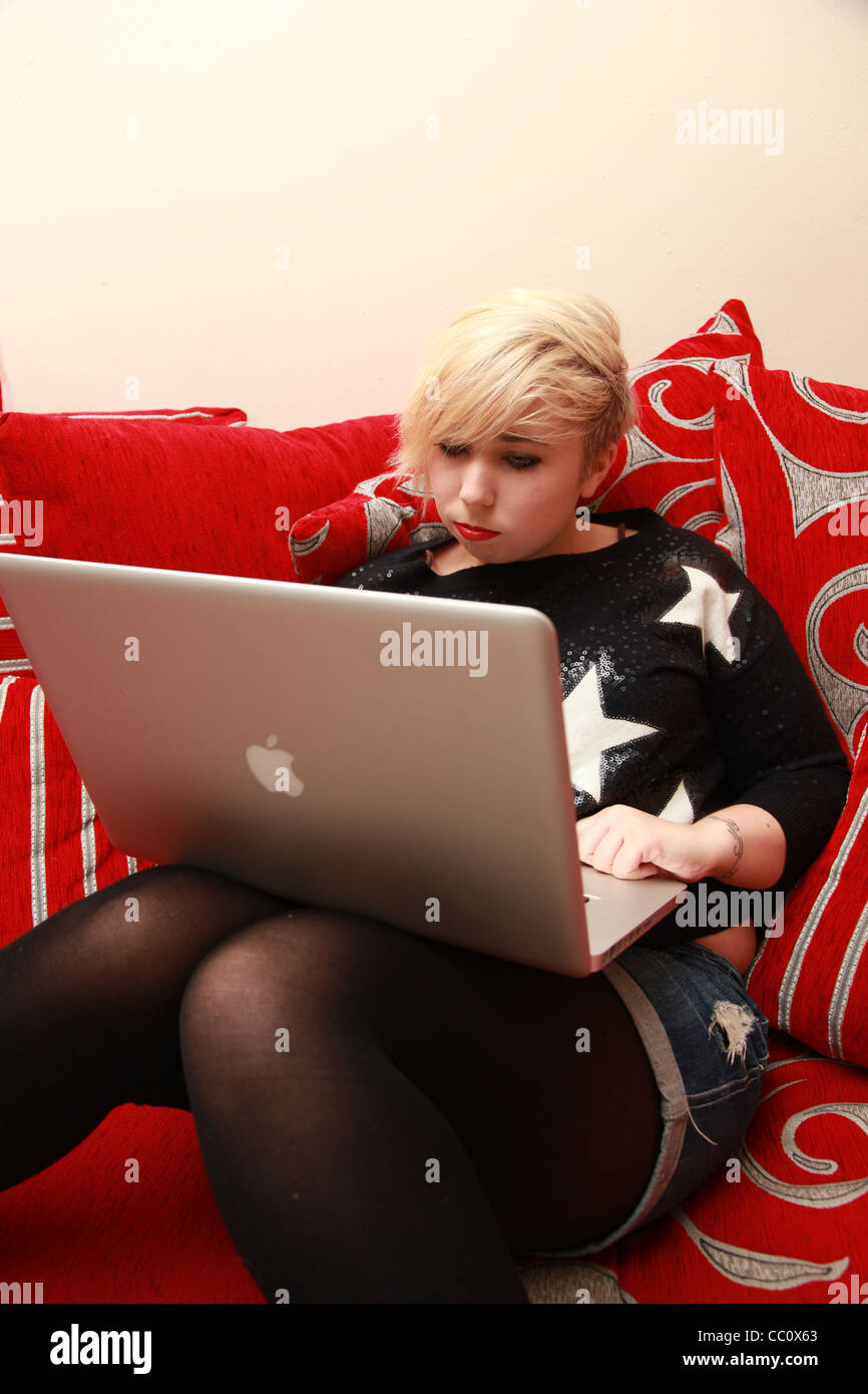 Student using an Apple laptop Stock Photo - Alamy