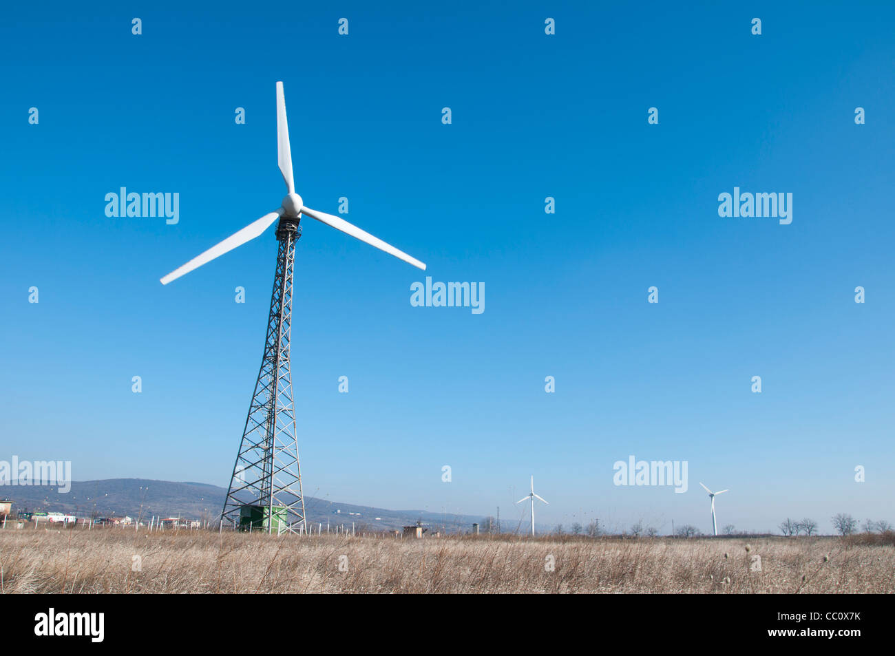 Wind generators on blue sky Stock Photo - Alamy