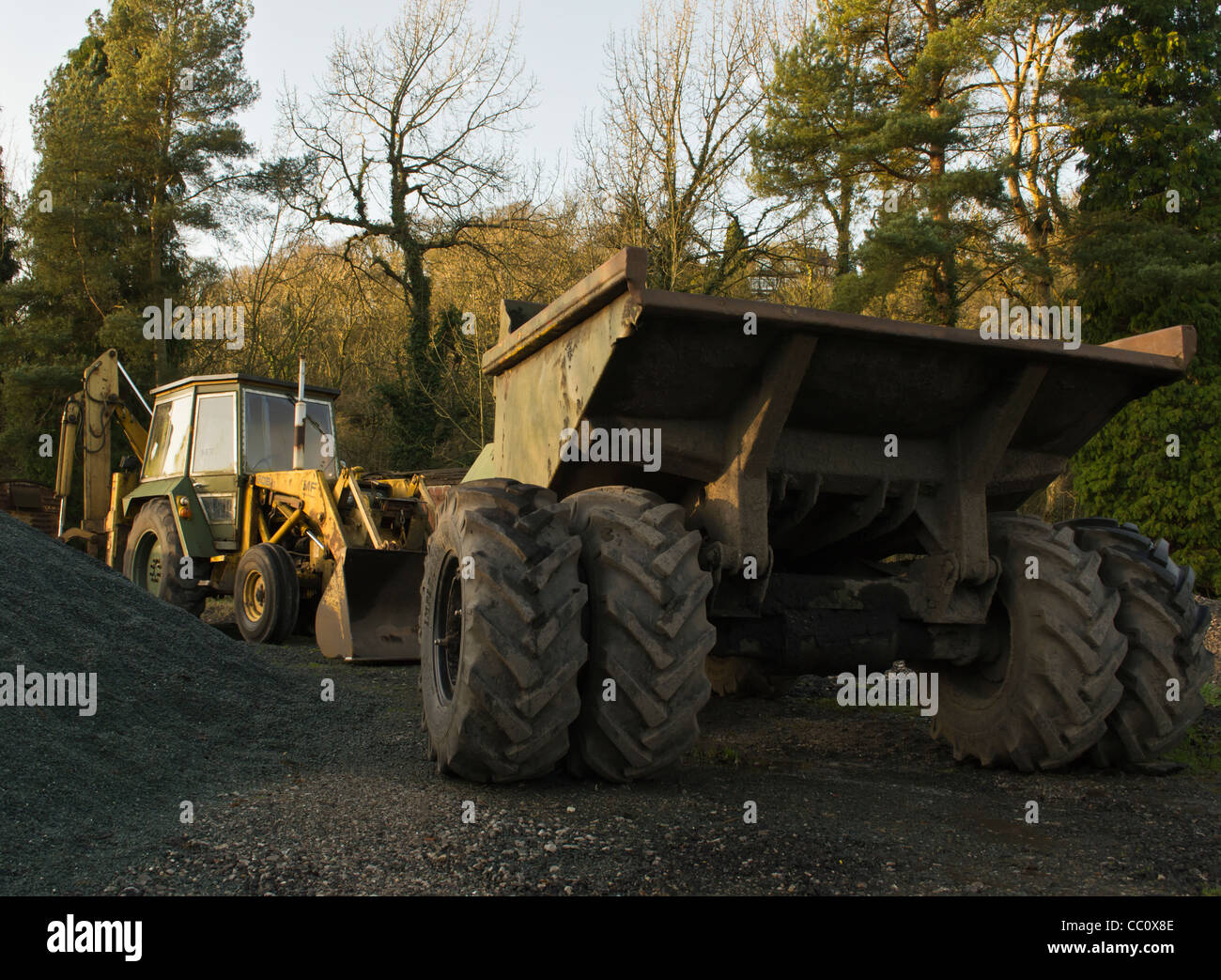 massey ferguson backhoe loader and four wheel drive dumper Stock Photo ...