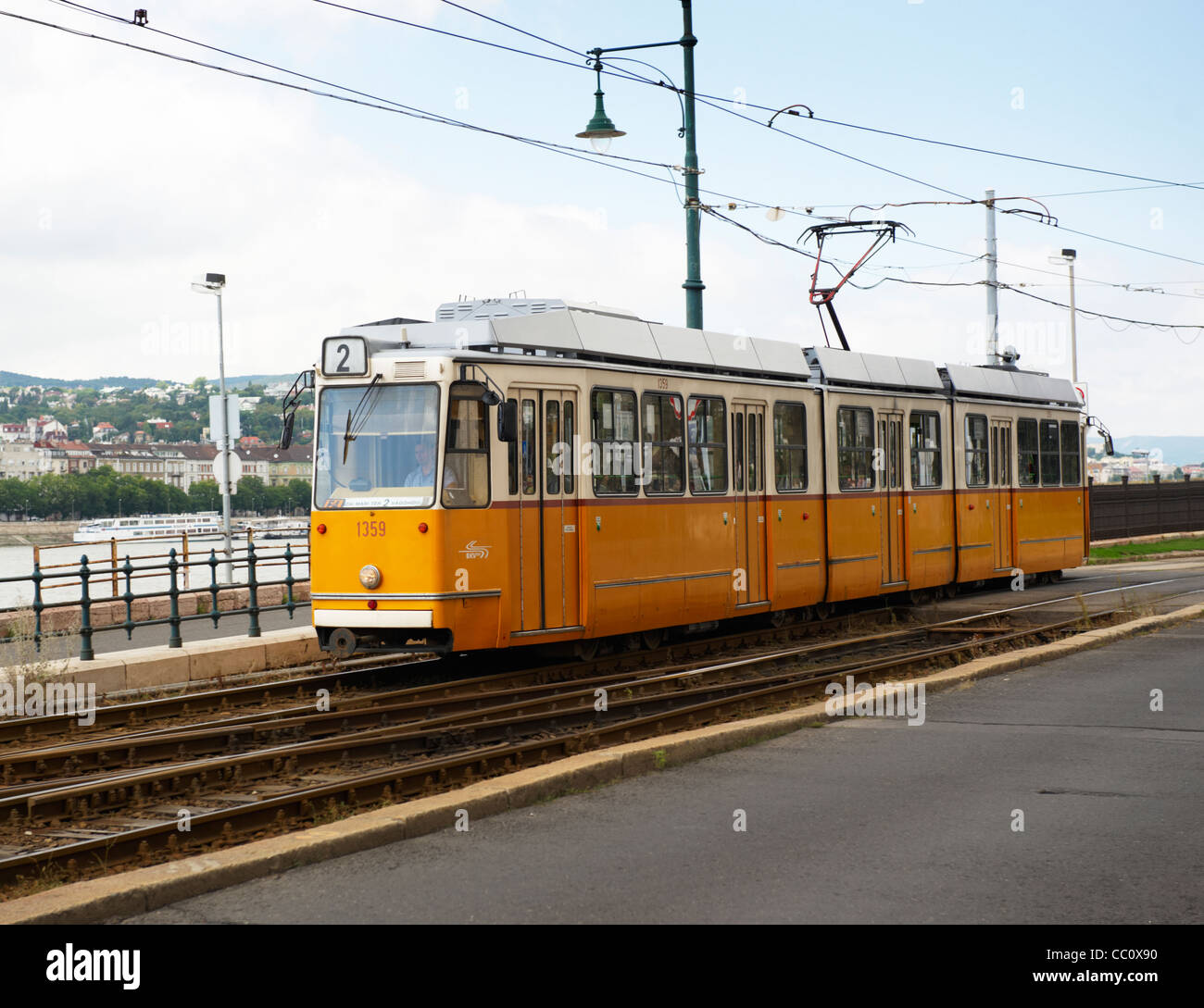 Electric trams form part of the public transport system in Budapest ...