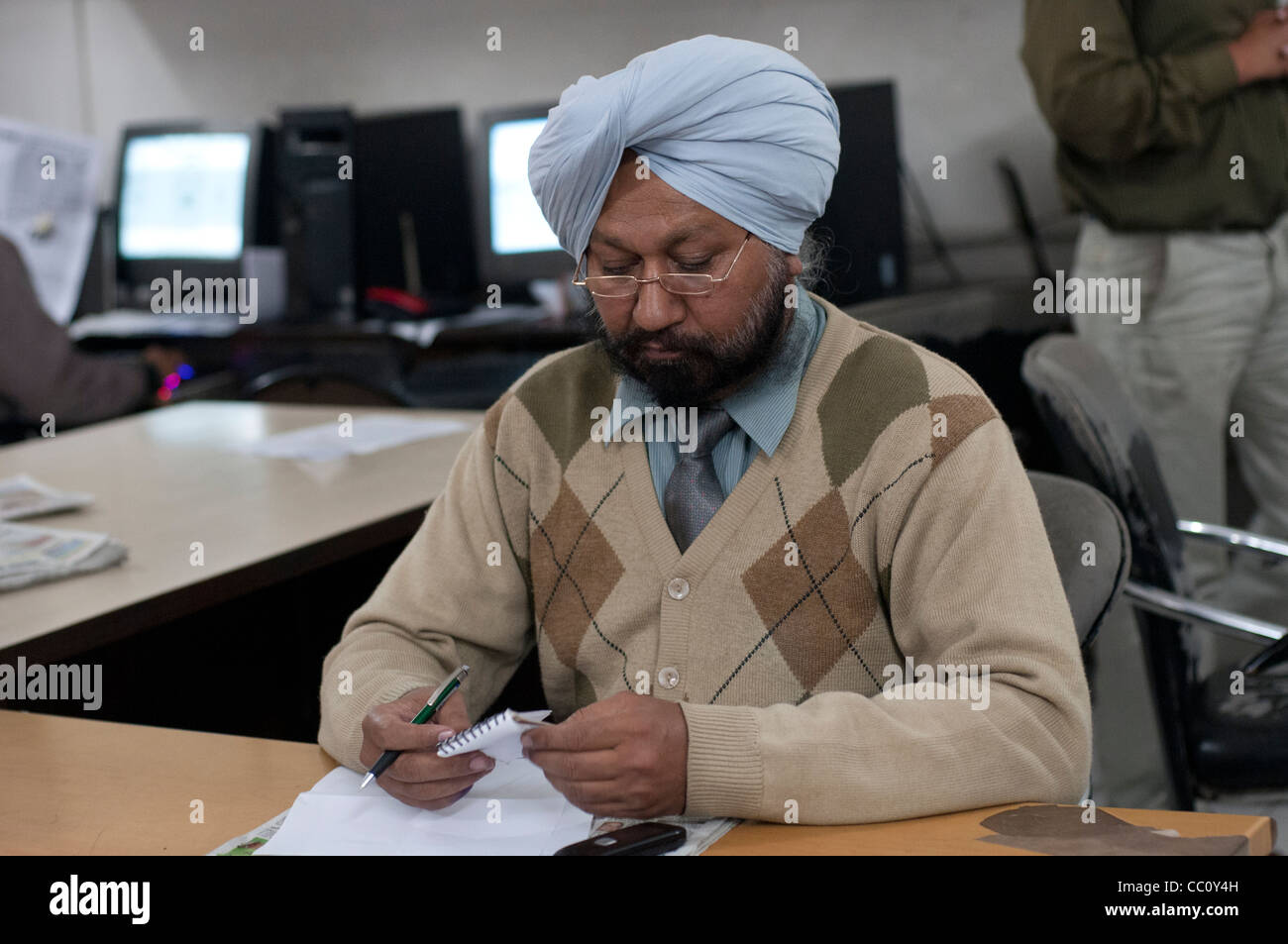 Journalist at the newspaper office at night, Chandigarh, India Stock ...