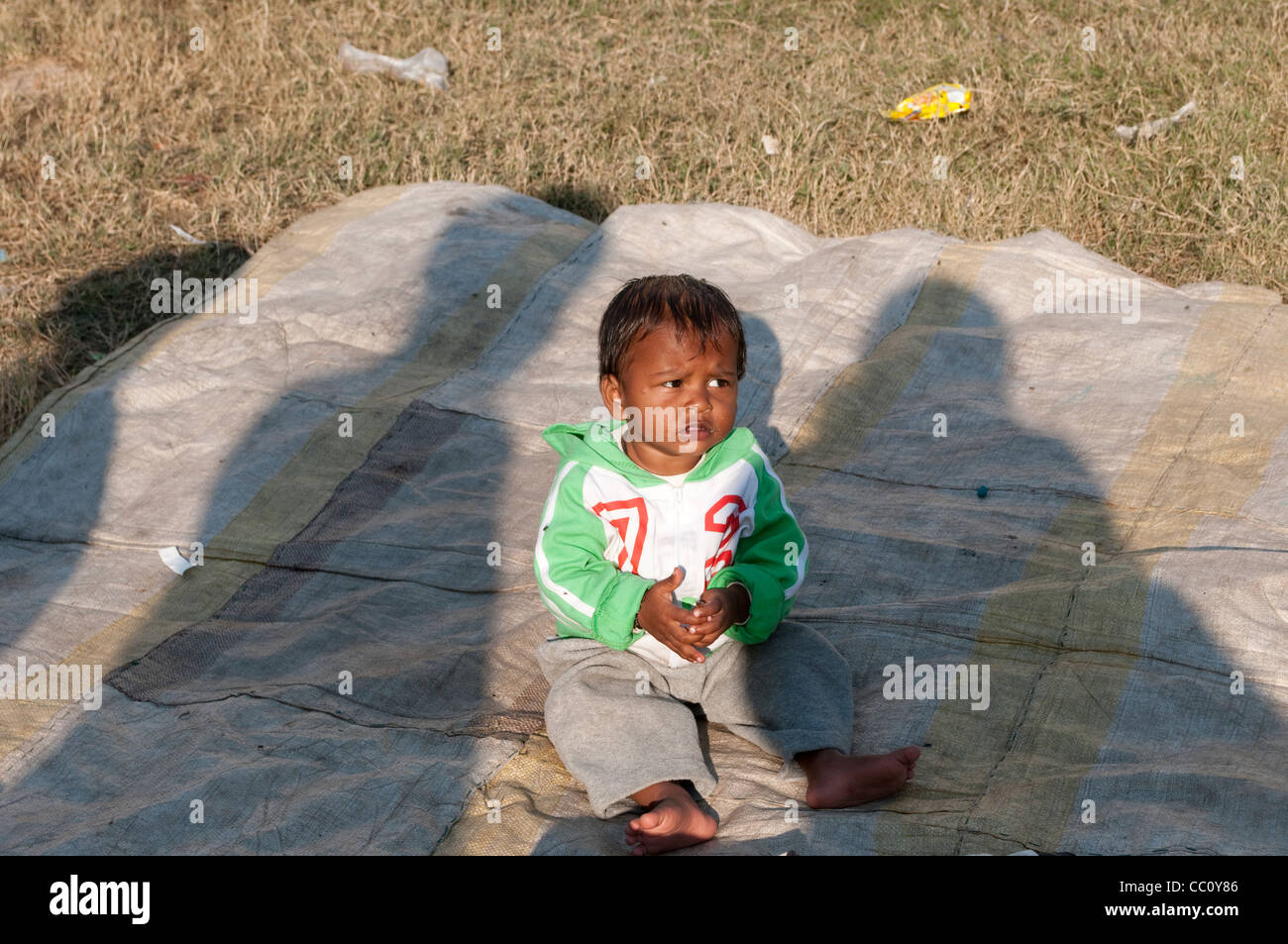 Child alone while his mother is working, Chandigarh, India Stock Photo ...
