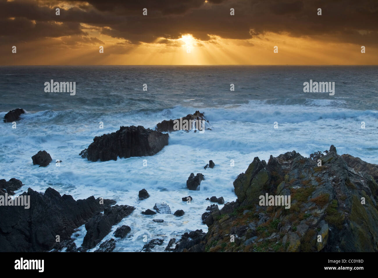 Sunset set over the Atlantic Ocean, looking out from Hartland Quay on ...