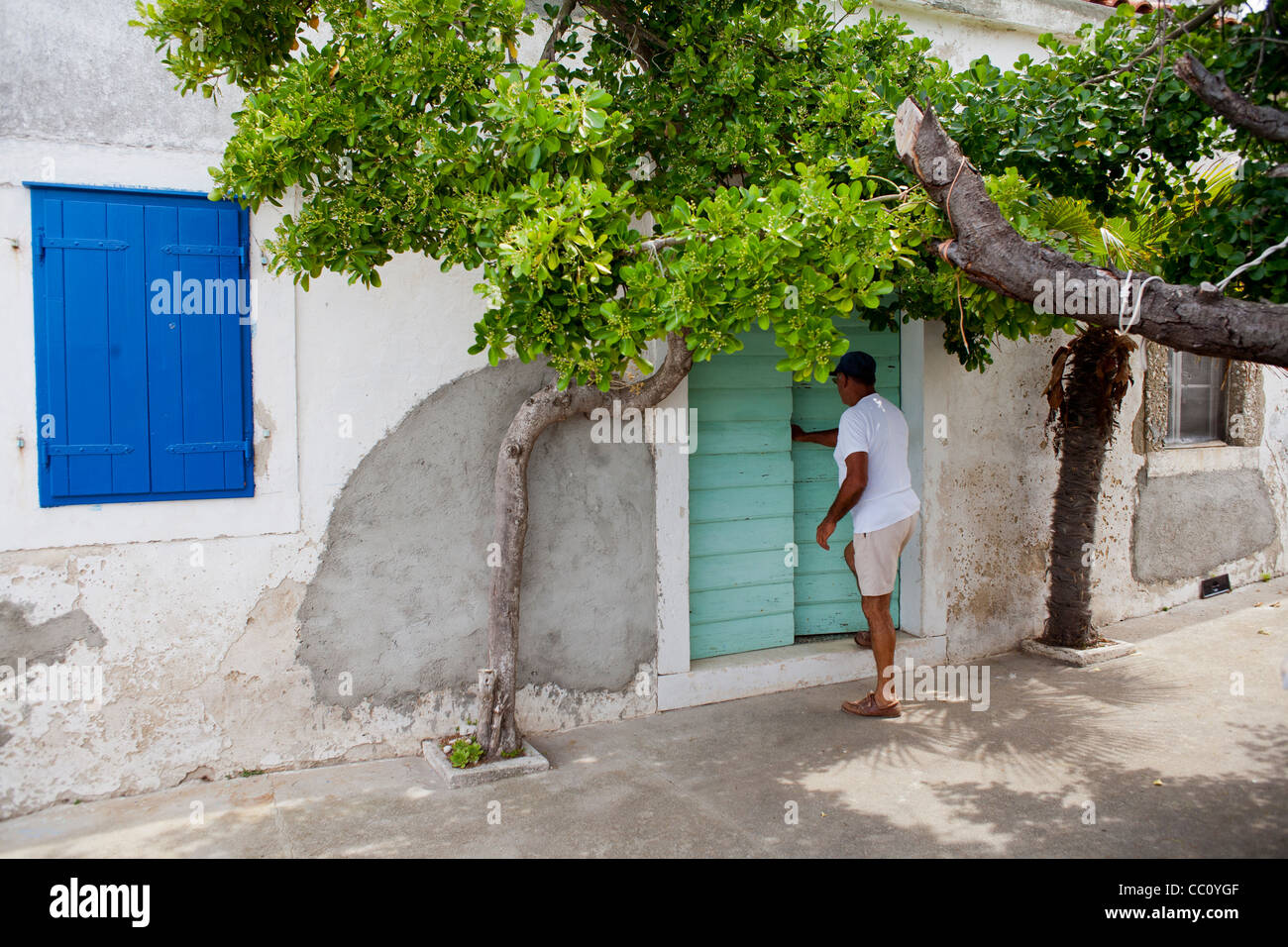 Man entering the house Stock Photo - Alamy