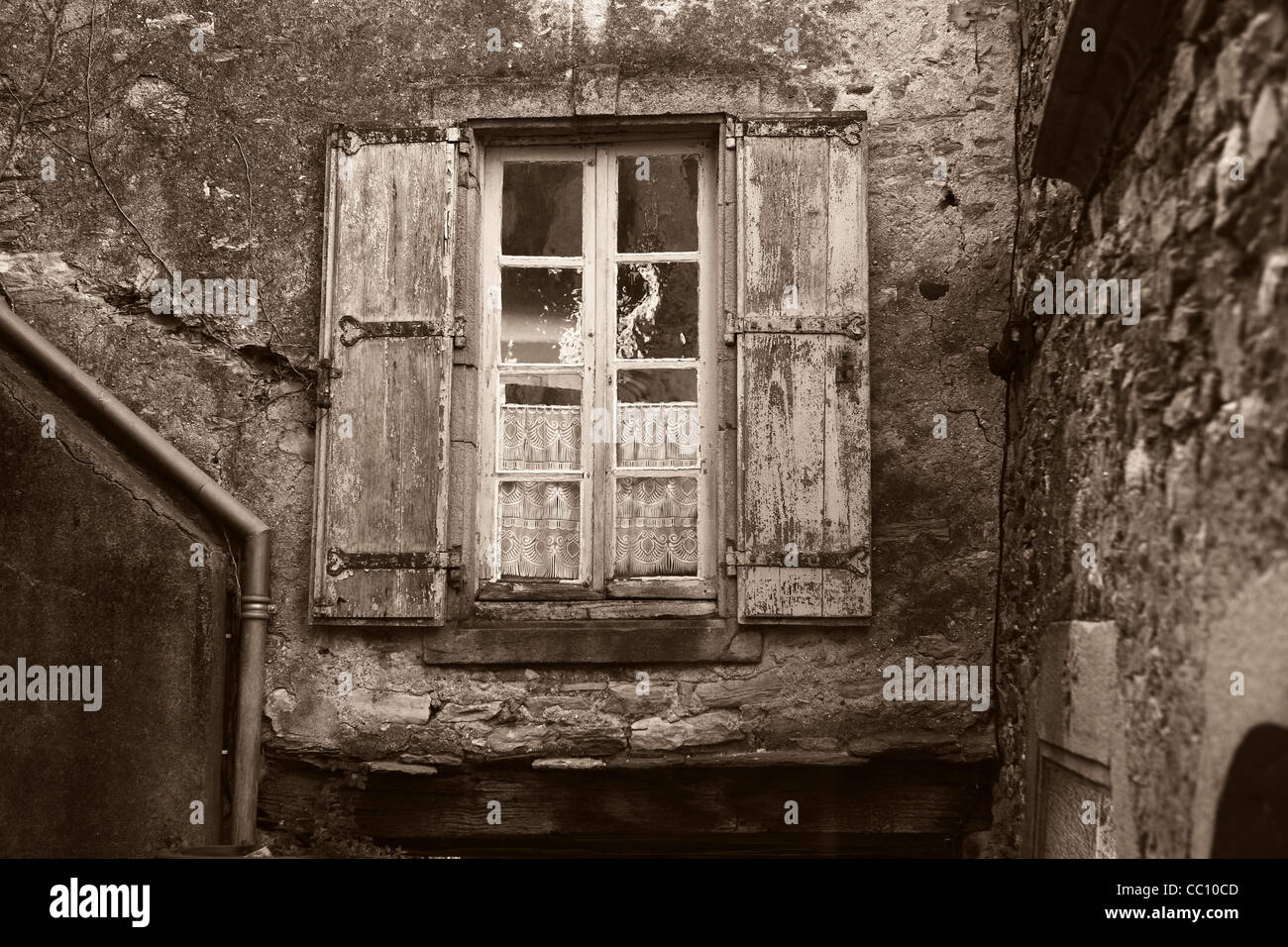 Old village window with shutters and lace curtains. Olargues. France ...
