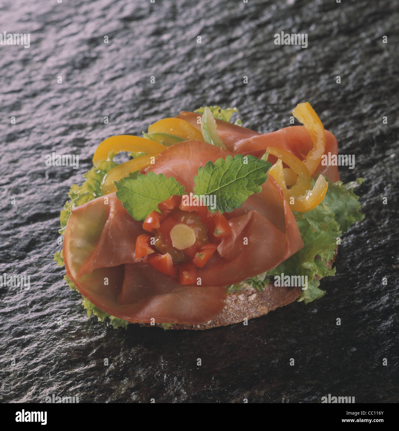 Still: Tomato - flower on rolled fillet of ham Stock Photo - Alamy