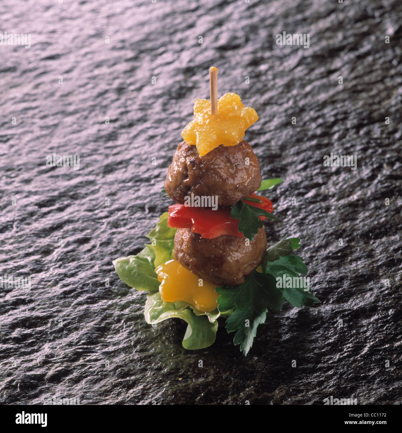 Still: Spit with fruit, vegetable and mincemeat dumplings Stock Photo ...