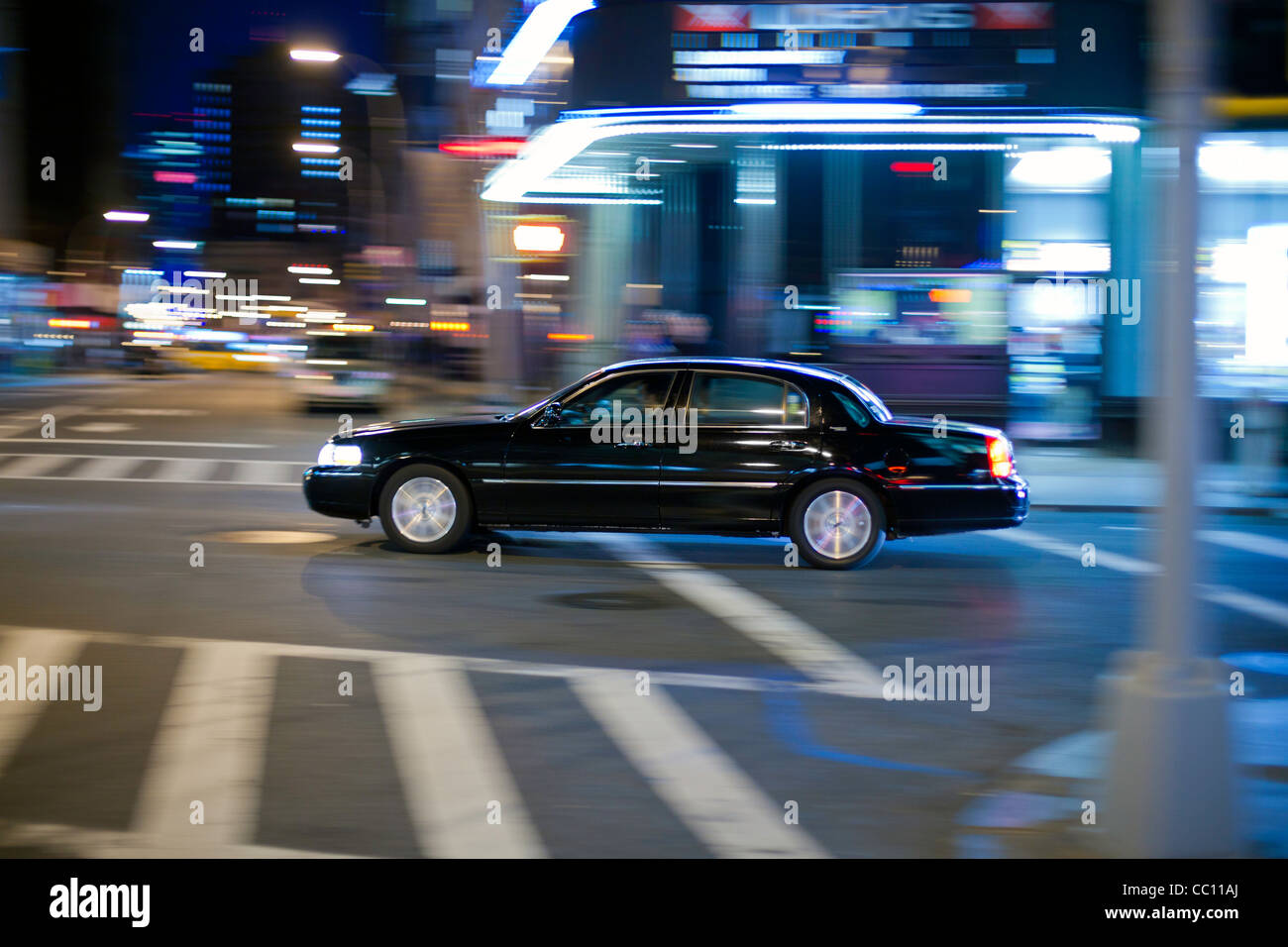 Black Limo at the crossroads. Manhattan street in the night Stock Photo ...