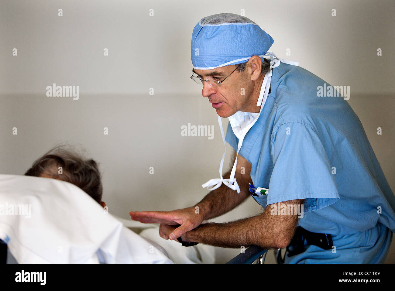 A doctor visits with a patient after an operation Stock Photo - Alamy