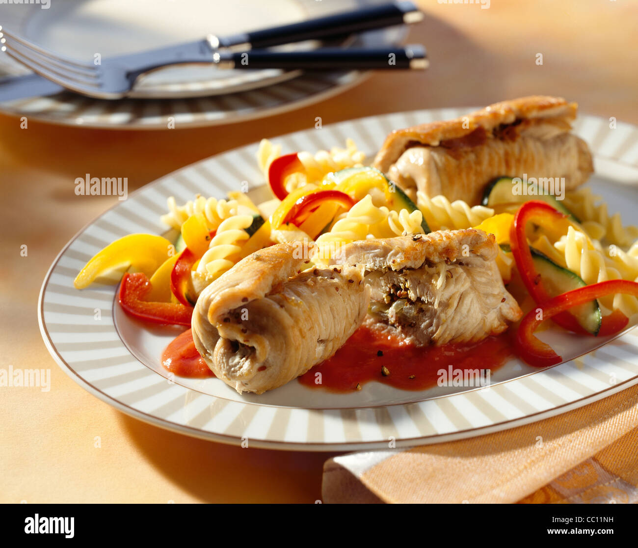 Turkey roulade with parma ham and vegetable noodles Stock Photo - Alamy